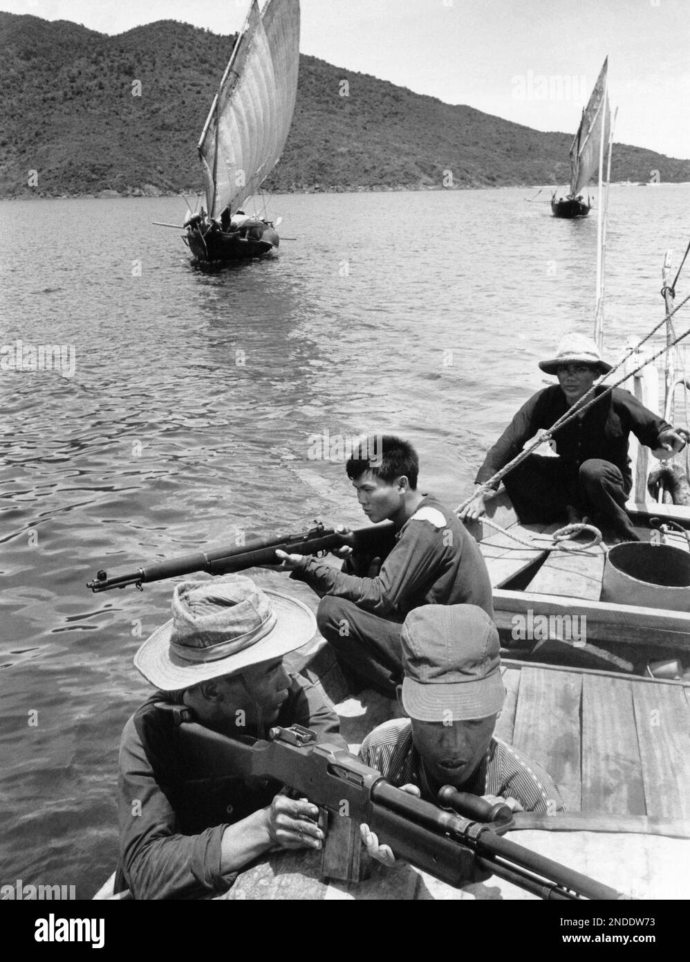 Four of five-man crew or armed Vietnamese junk as they took part in ...
