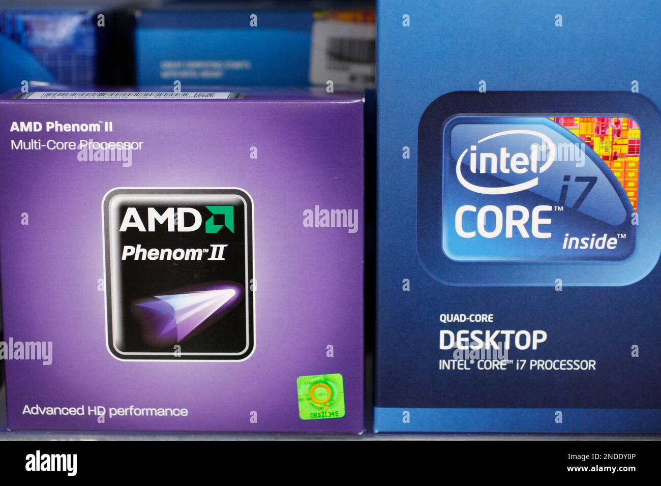 An Intel chip, right, is shown, next to an AMD chip, left, that is on ...