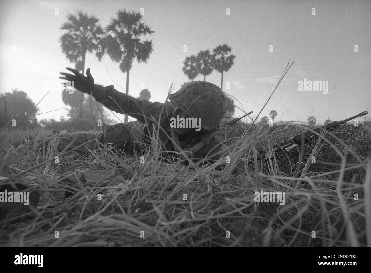 Cambodian Army soldier yells as he signals his buddies forward during ...