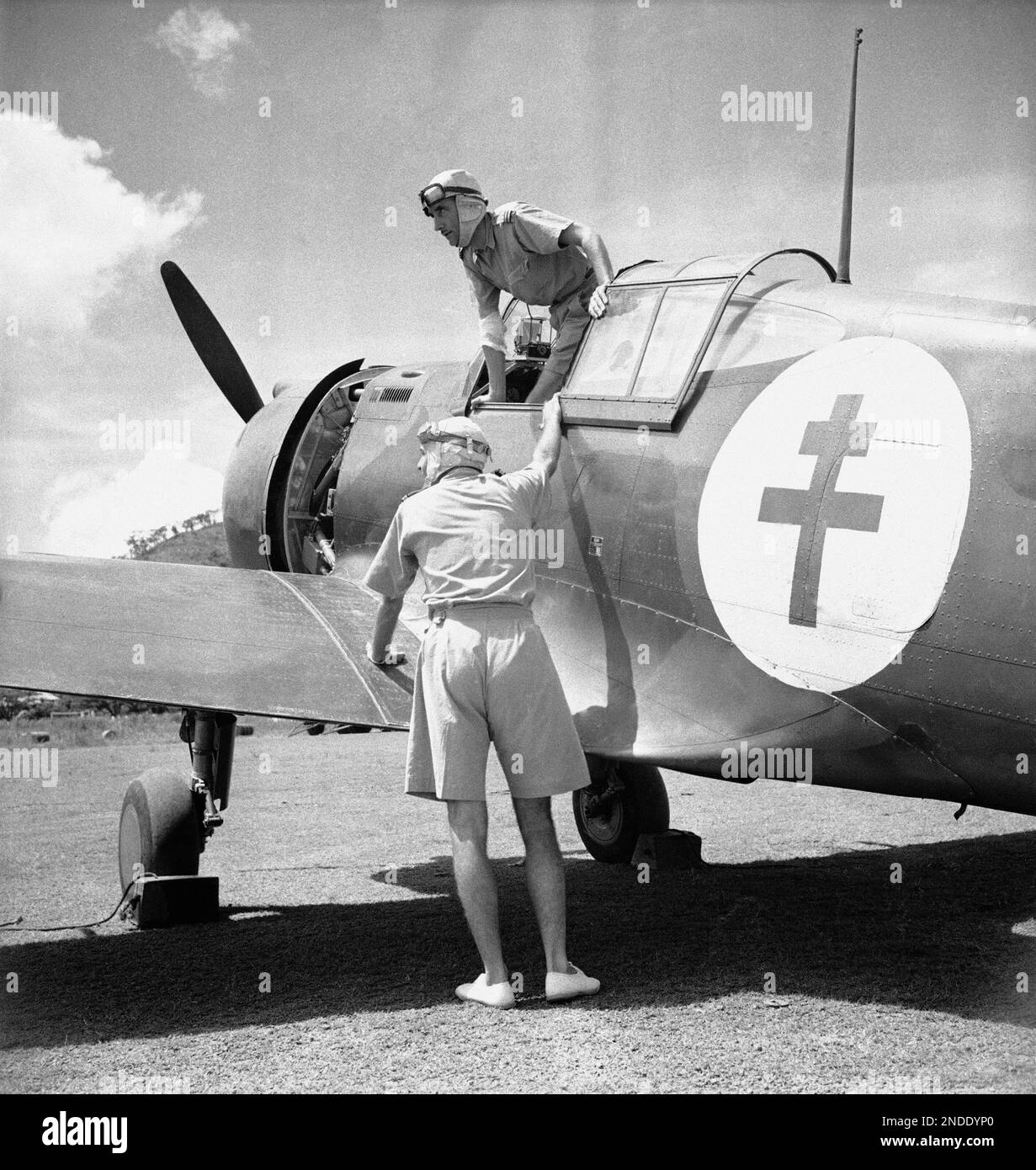Lt. Charles Varney, getting out of cockpit in Brazzaville August 13 ...