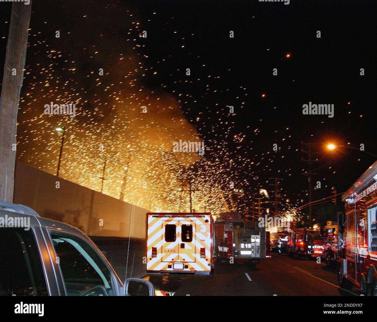 An explosion sends flames and hurling chunks of molten titanium from an ...