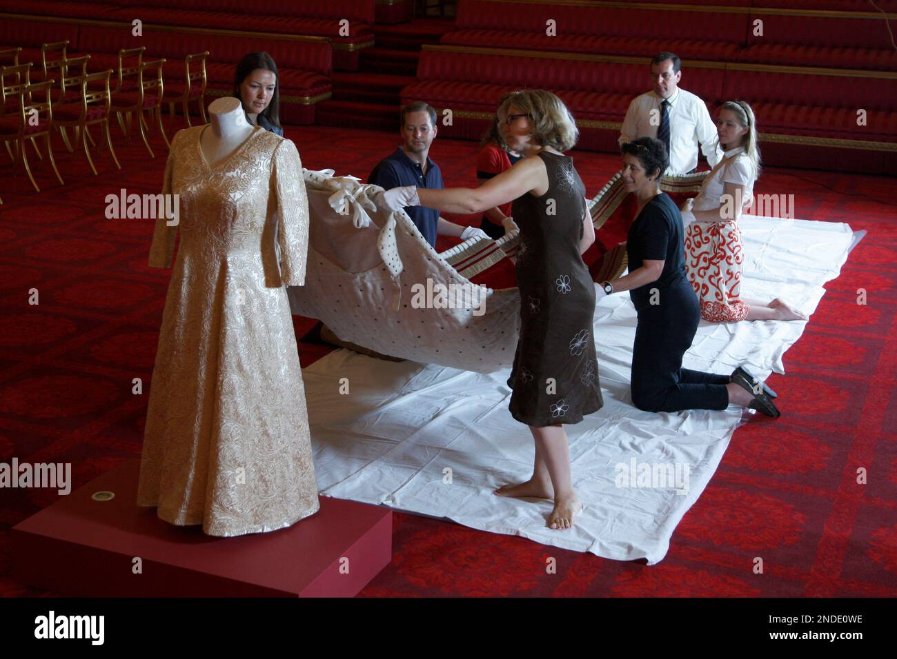 Staff members prepare for public display, the Robe of State used by ...