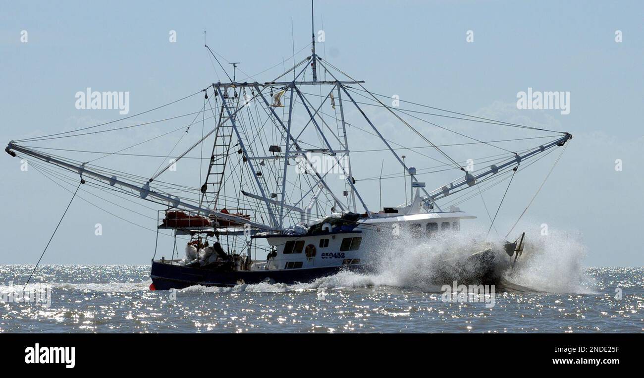 The shrimp trawler Our Dream makes its way into the Gulf of Mexico near ...