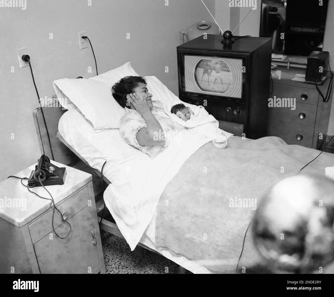 Mrs. Sandra Patterson, wife of heavyweight Floyd Patterson, holds their ...