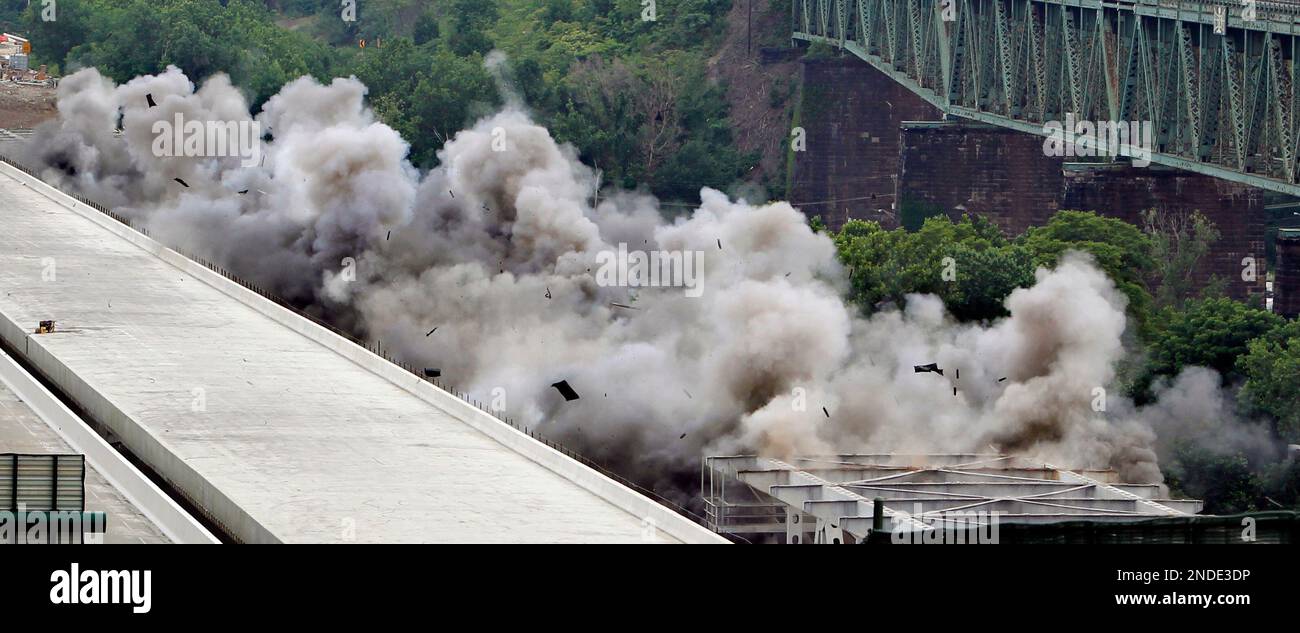 Flying debris and a dust cloud can be seen from Oakmont, Pa., as it ...
