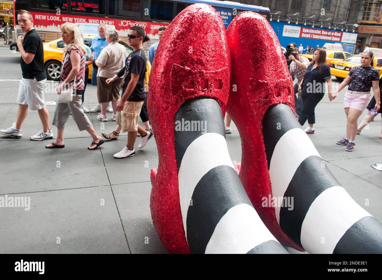 Six-foot tall ruby red slippers are unveiled on 42nd Street outside of Madame Tussauds to ...