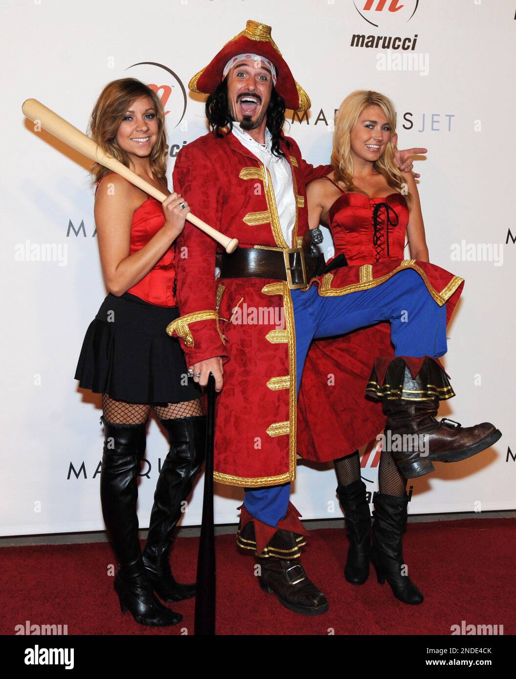 Captain Morgan and the Morganettes pose with baseball bats on the red ...