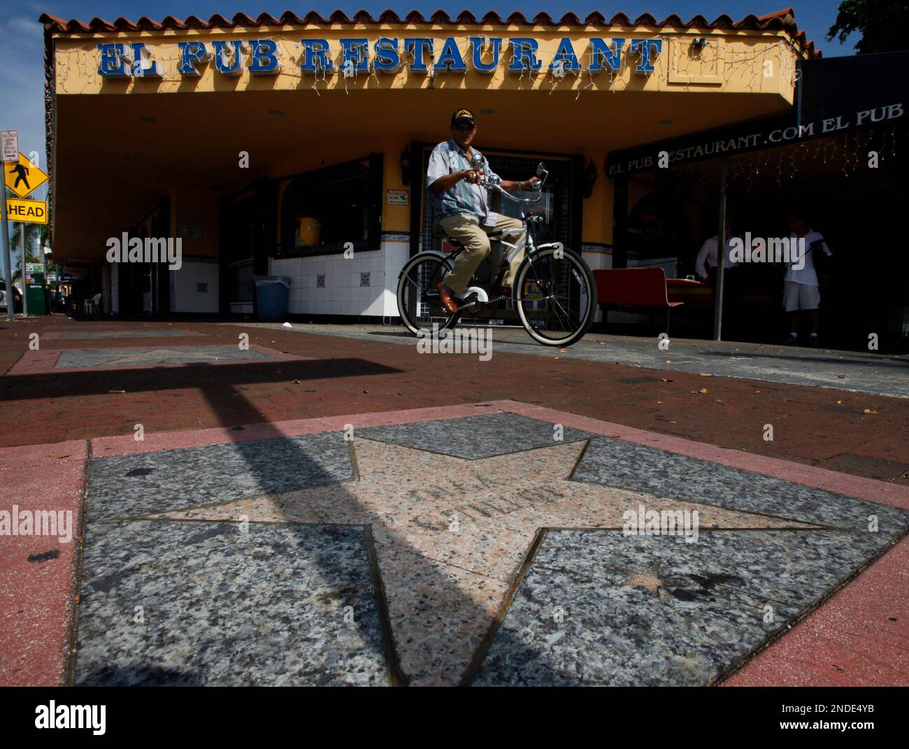 A cyclist rides past the star of Olga Guillot, the legendary Cuban ...