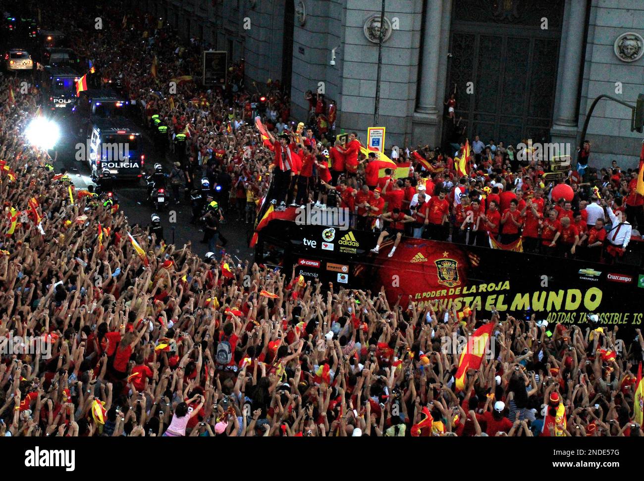 People watch as the Spanish national team parades through Madrid's ...