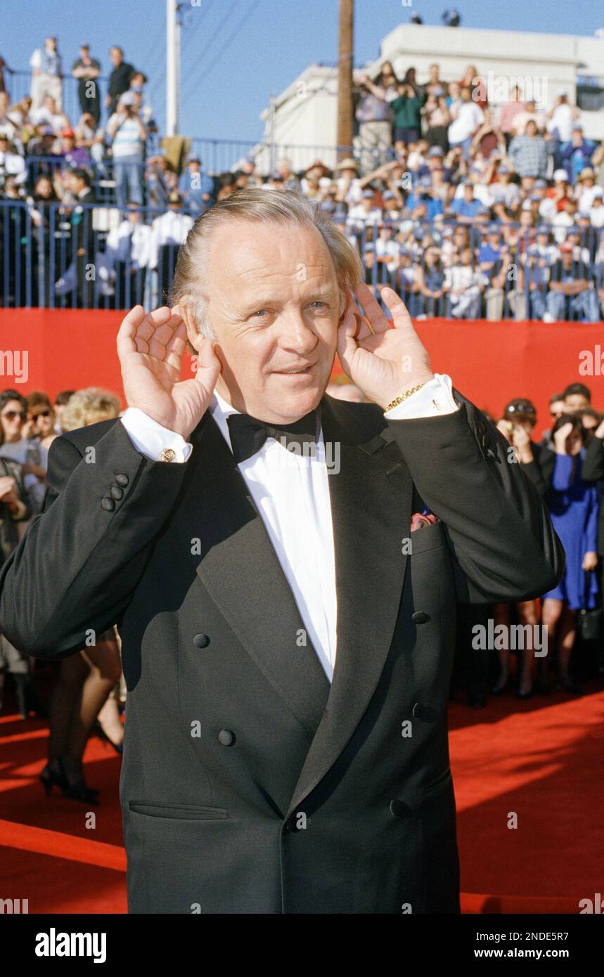 Oscar winner Anthony Hopkins strains to hear as he arrives at the 67th ...