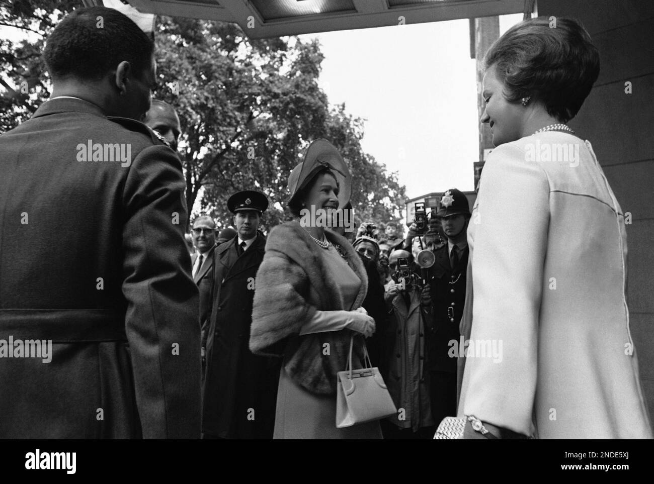 Queen Elizabeth II is greeted by Princess Muna, the British born wife ...