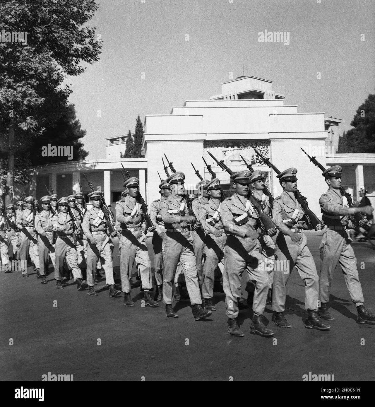 A detachment of Iran’s royal guard parades in front of the Royal Palace ...