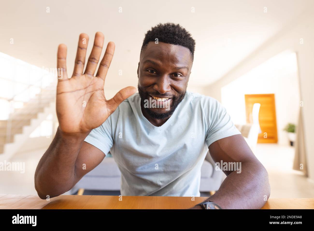 Portrait cheerful african man waving hi-res stock photography and ...