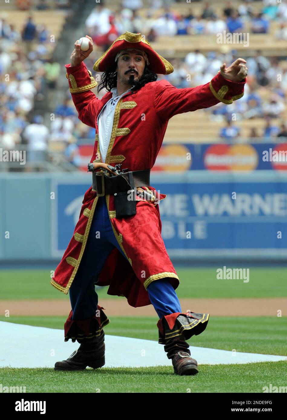 Captain Morgan and the Morganettes poses with fans after throwing out ...