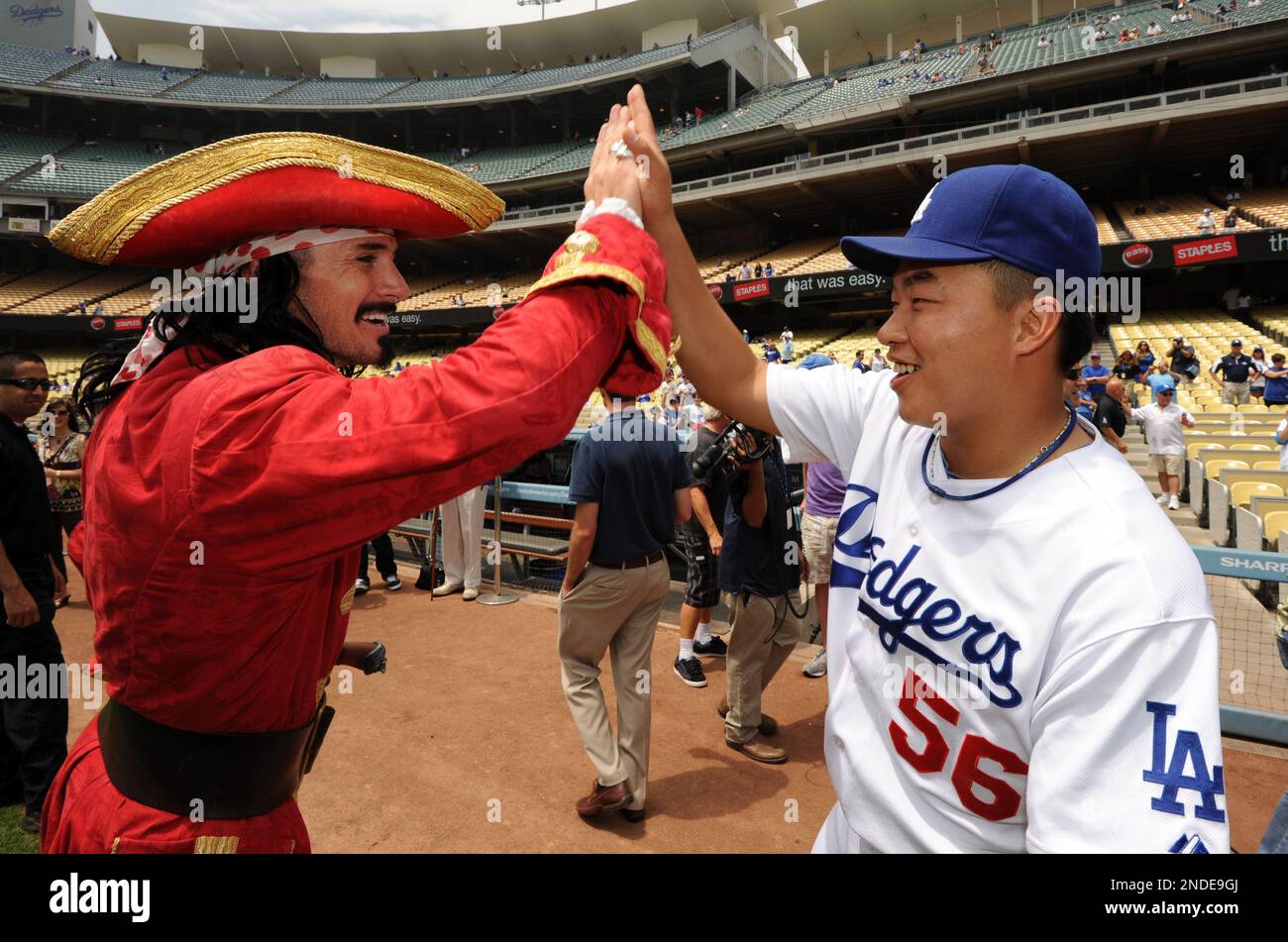 Captain Morgan high fives Los Angeles Dodgers pitcher Hong-Chih Kuo ...