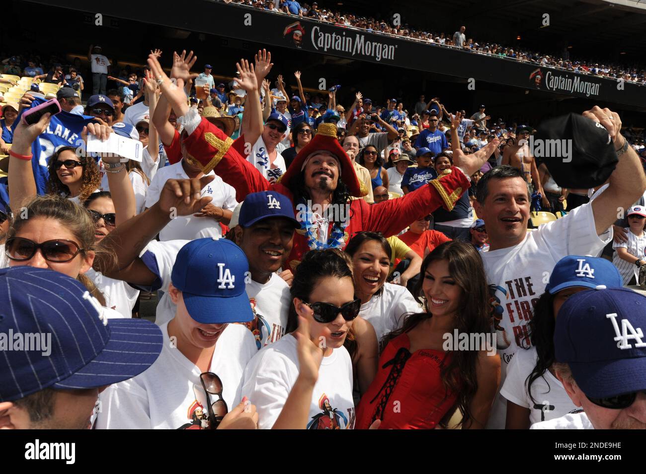 Captain Morgan and the Morganettes poses with fans after throwing out ...