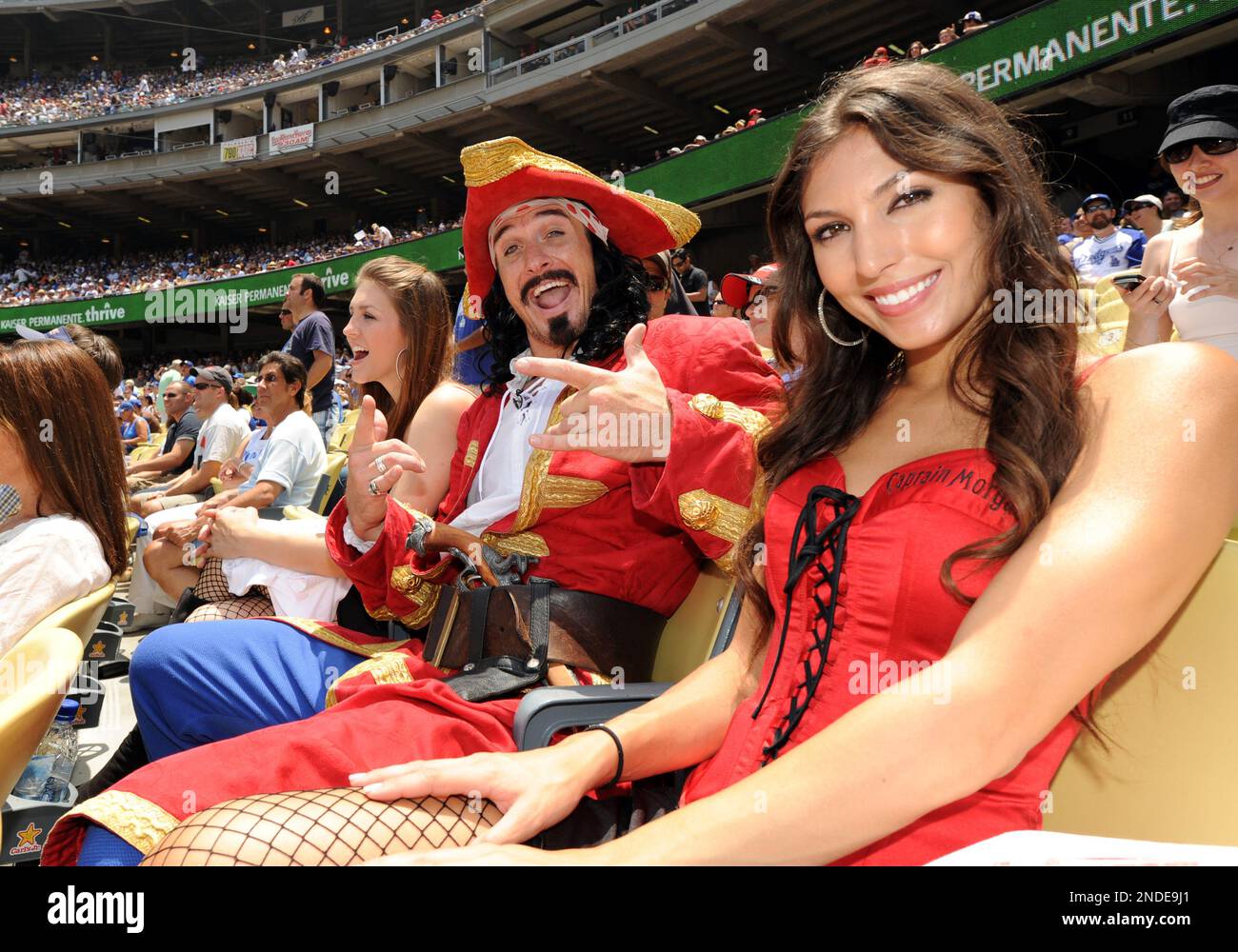 Captain Morgan and the Morganettes poses with fans after throwing out ...