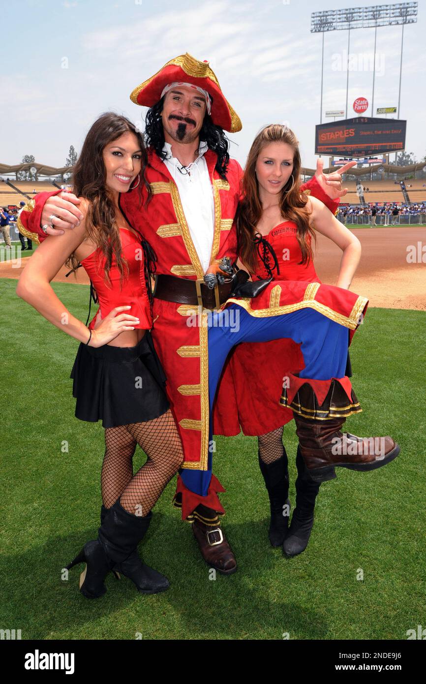 Captain Morgan and the Morganettes poses with fans after throwing out ...