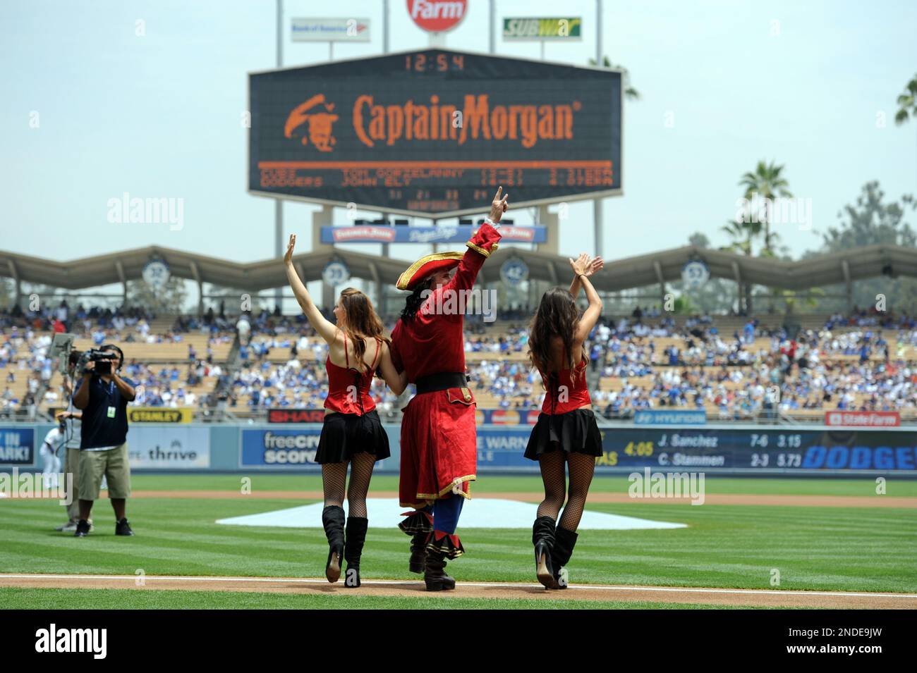Captain Morgan and the Morganettes poses with fans after throwing out ...