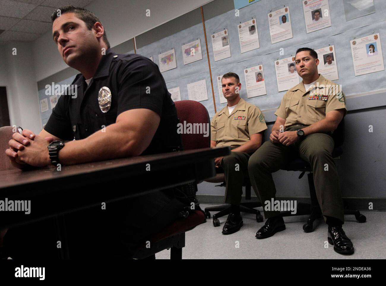 In this photo taken July 1, 2010, Staff Sgt. Brendan Flynn, background ...