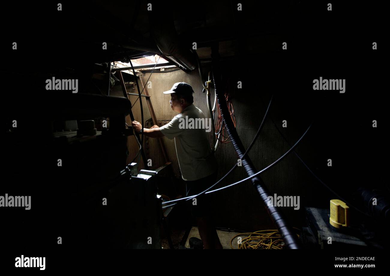 In this June 30, 2010 photo, Tom Huynh climbs out of the engine room on ...