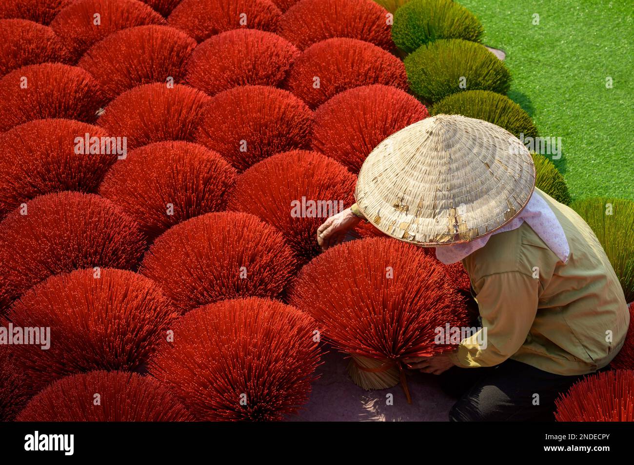 Traditional farmer with incense sticks in field Stock Photo - Alamy