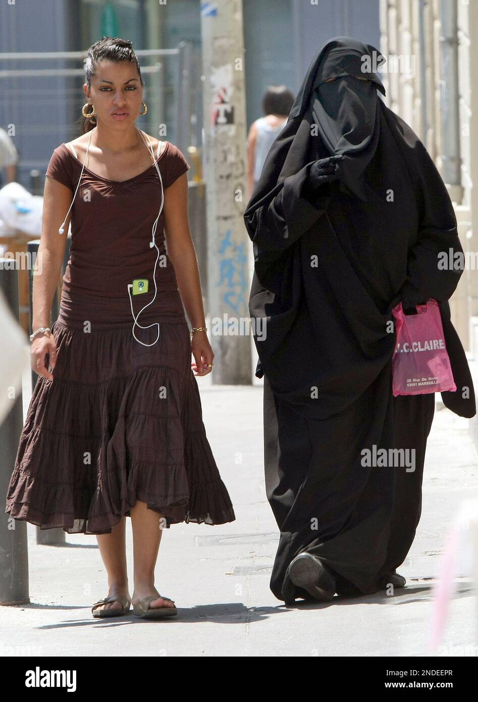 FILE - In this June 19, 2009 file photo, two women, one wearing the ...