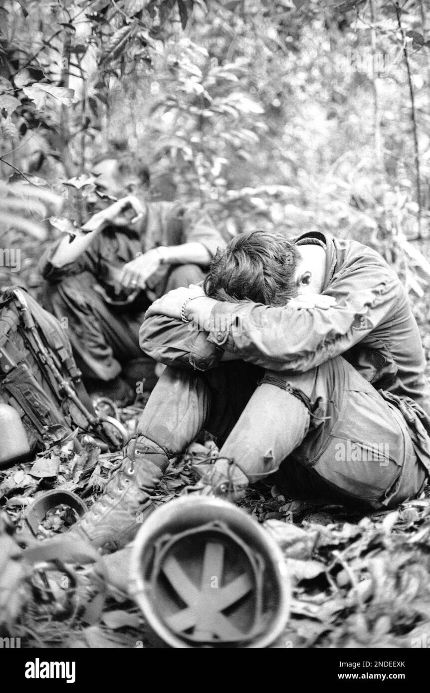 A weary GI rests this way during a break in a patrol through the ...