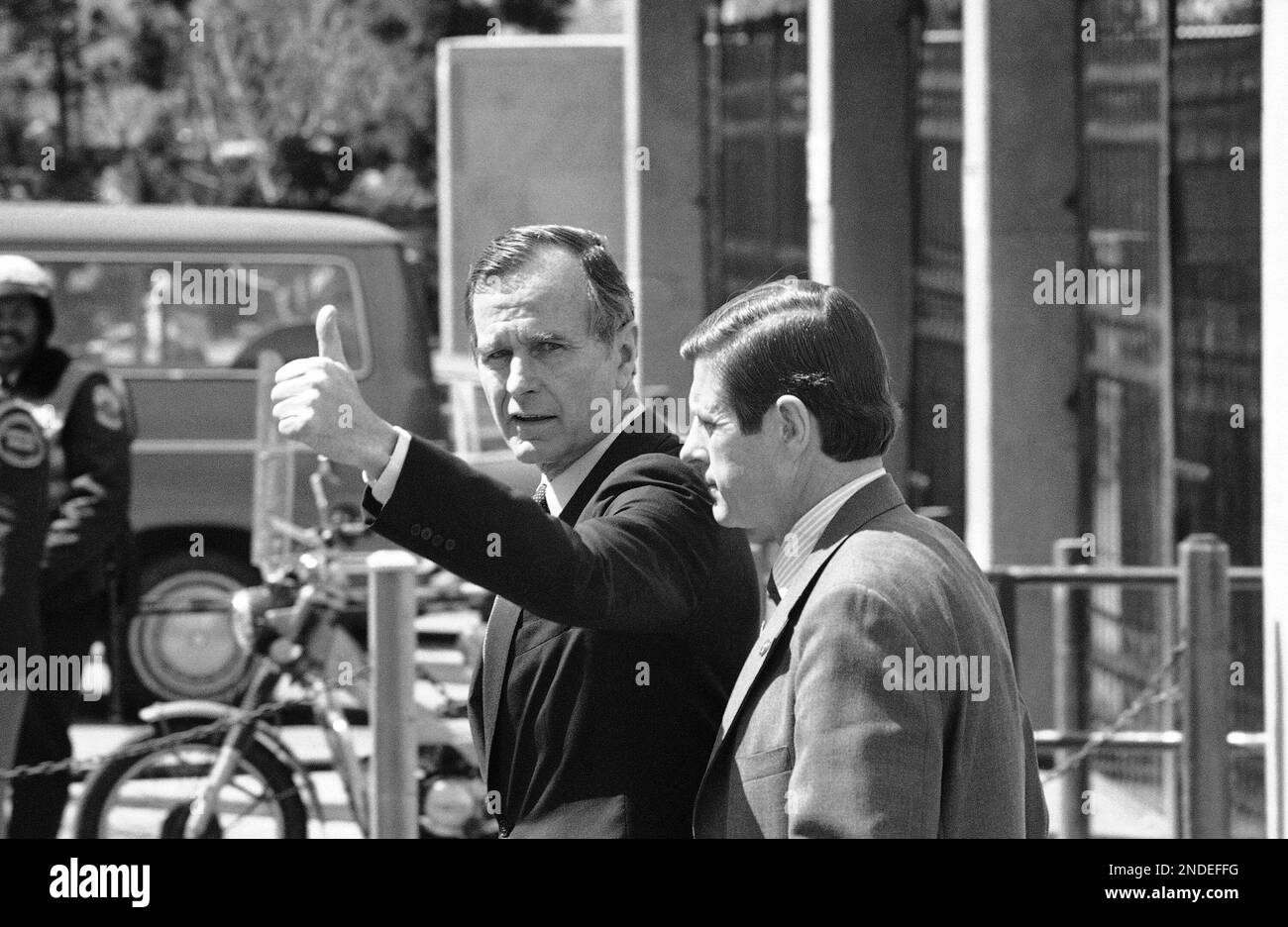 Vice President George Bush gives a "thumbs up" sign after visiting ...