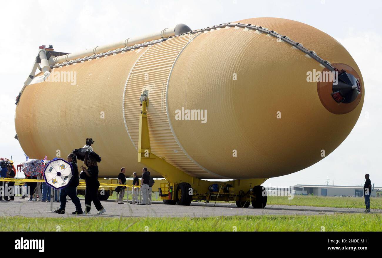 Lockheed Martin employees walk past the last external fuel tank built ...