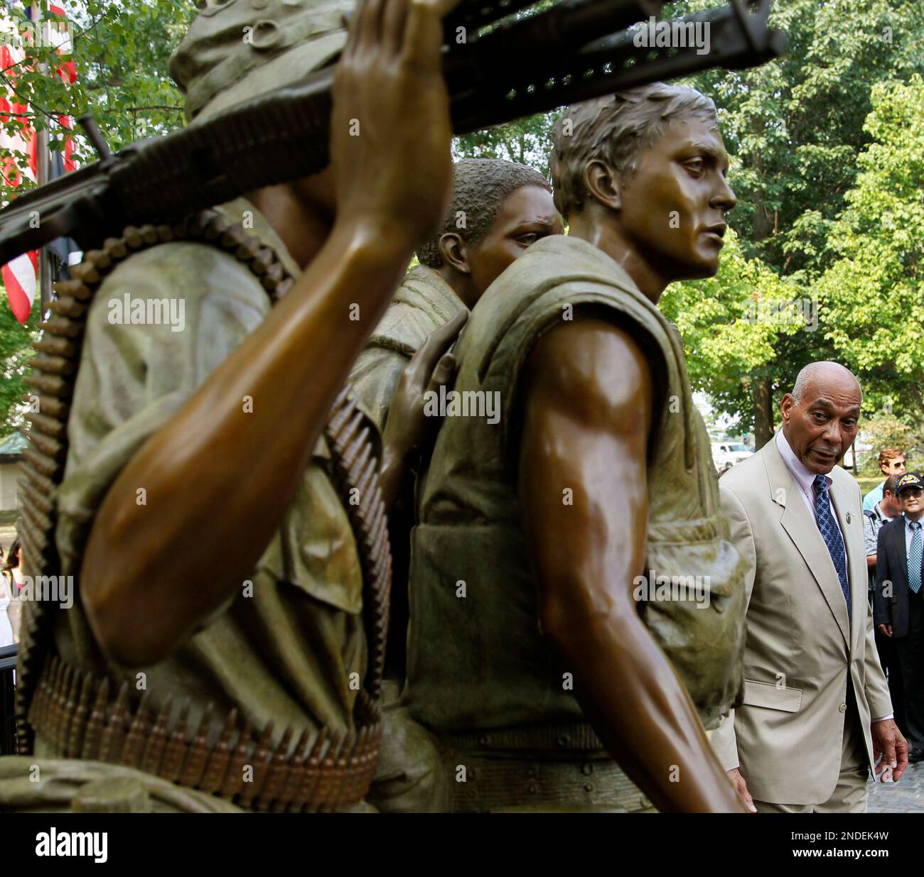 Retired Army Brig. Gen. George Price, looks at the Three Servicemen ...