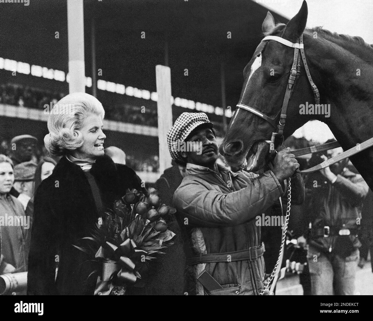 Penny Chenery, owner of Secretariat, and groom Eddie Sweat stand in ...
