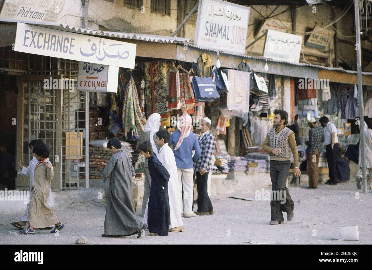 Locals walk in the street in Doha, Qatar in 1980. (AP Photo/Randy ...