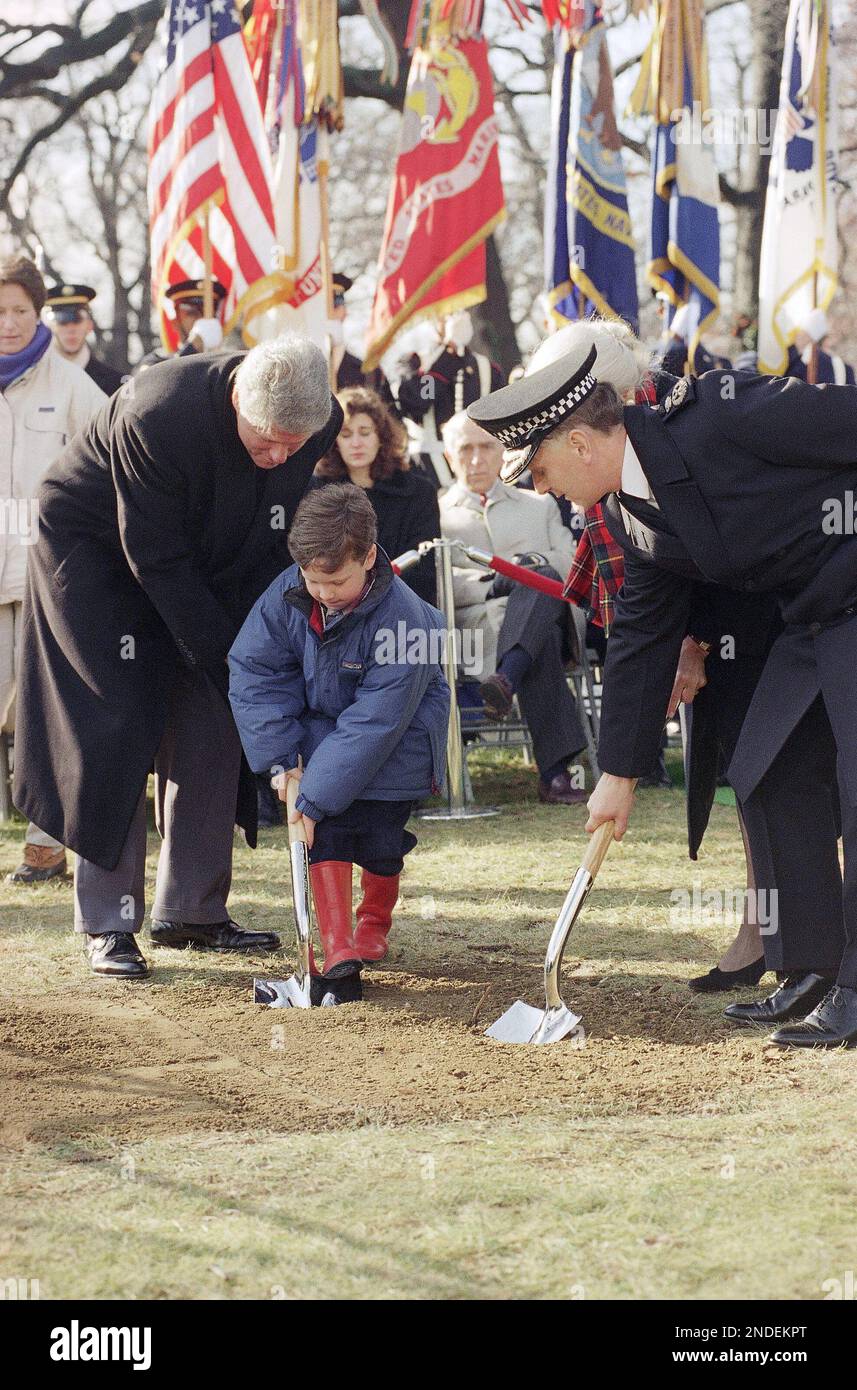 President Bill Clinton helps five-year-old Nicholas Bright break ground ...