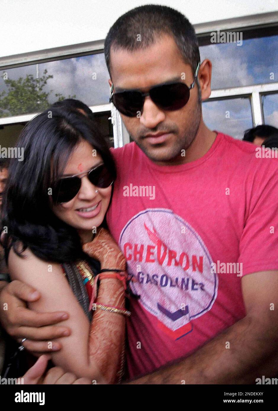 Newly married Indian cricket captain Mahendra Singh Dhoni and his wife Sakshi arrive at the ...