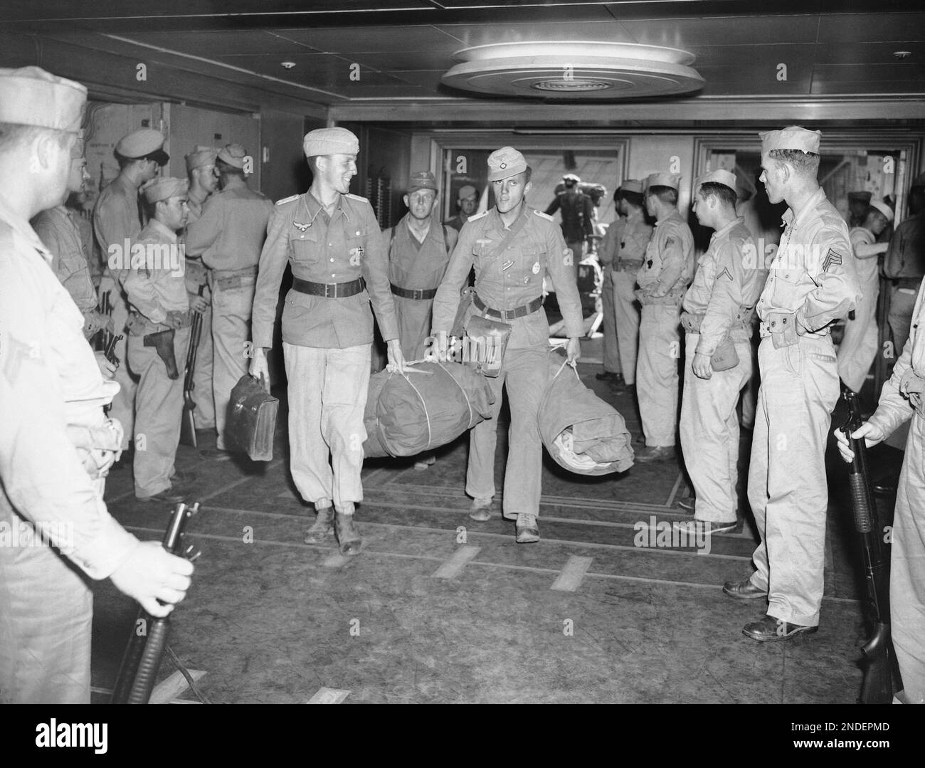 Carrying their possessions, German officers captured by Allied forces ...