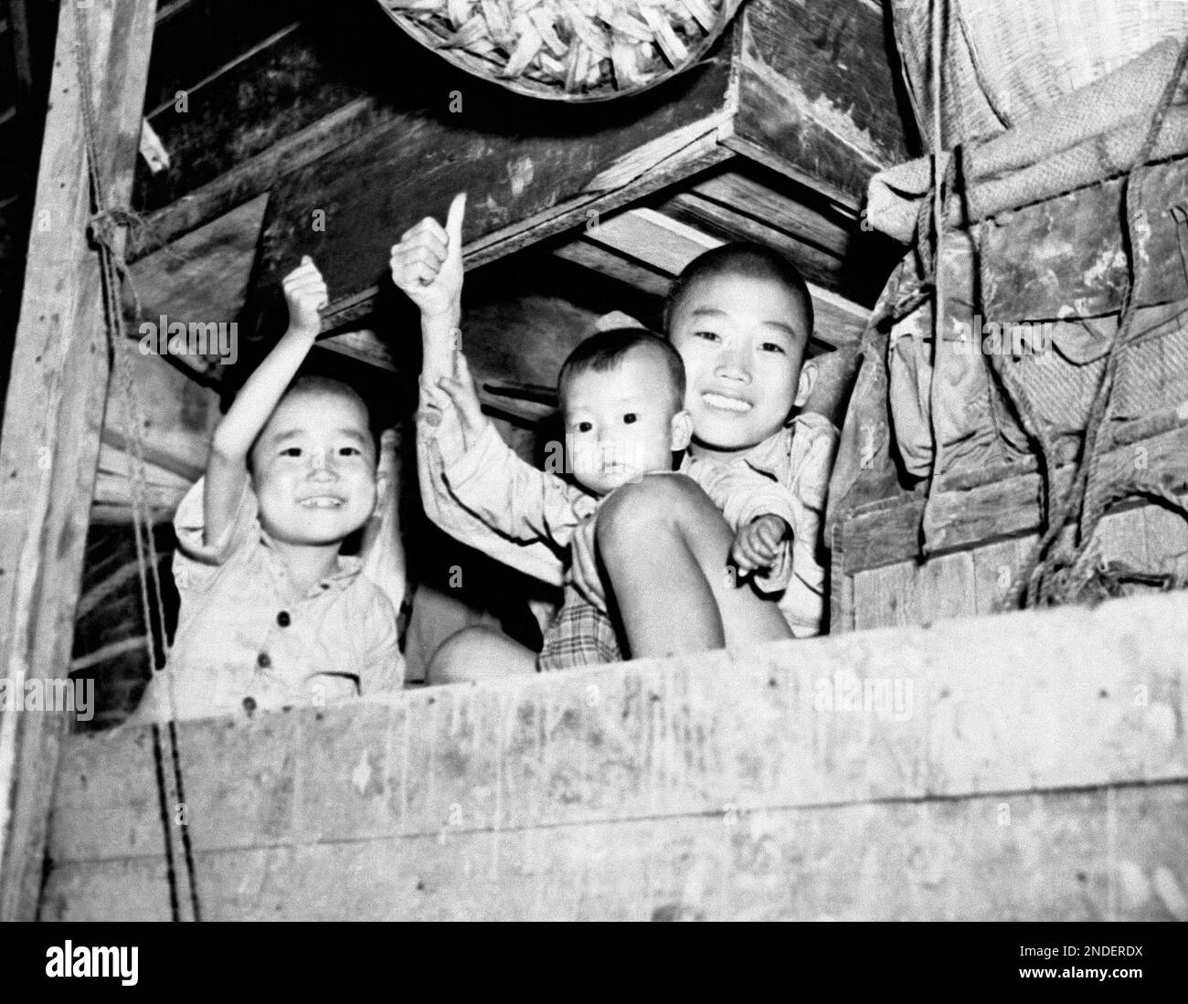 “Thumbs Up,” say these smiling Chinese youngsters as they get set to ...
