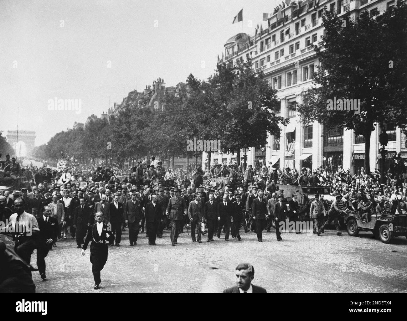 Through streets lined with madly cheering Parisians, General Charles De ...