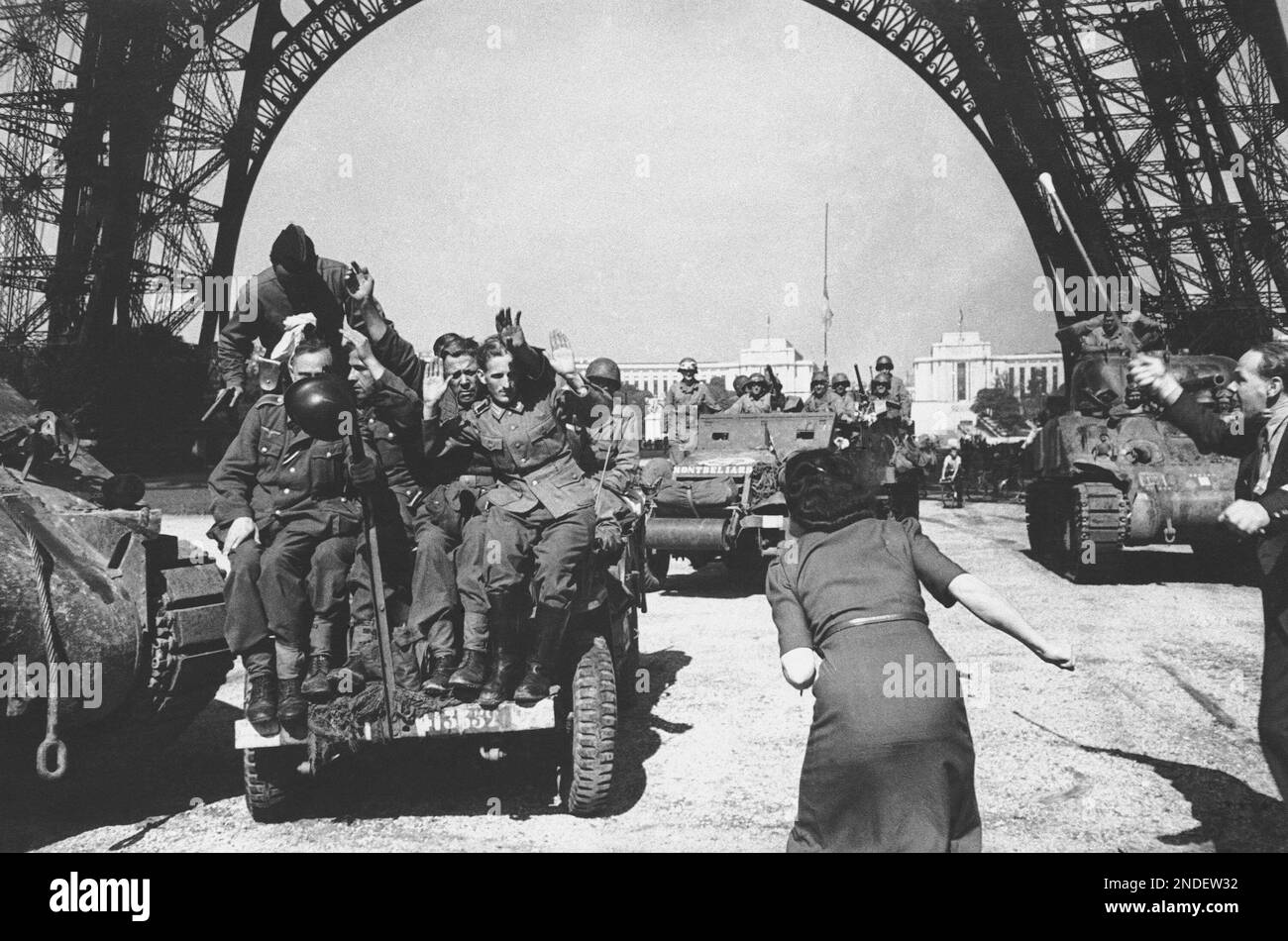 Nazi prisoners shrink from jeering Parisians as they are driven under ...