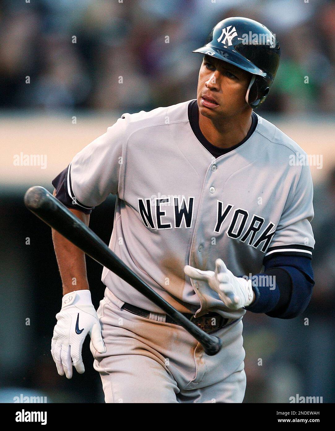 New York Yankees' Alex Rodriguez drops his bat after hitting a grand ...