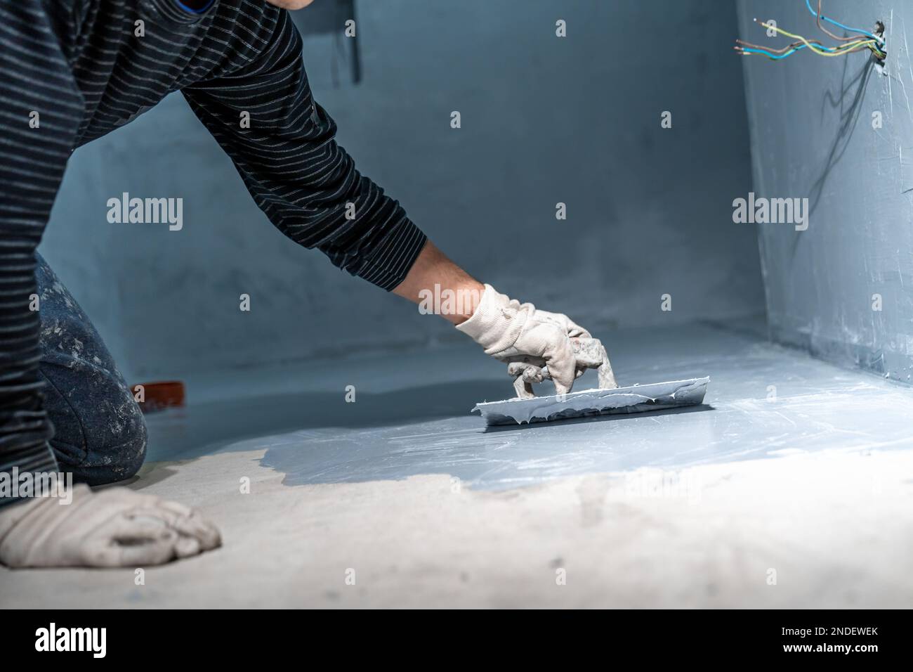 waterproofing of the bathroom floor in a new building Stock Photo - Alamy
