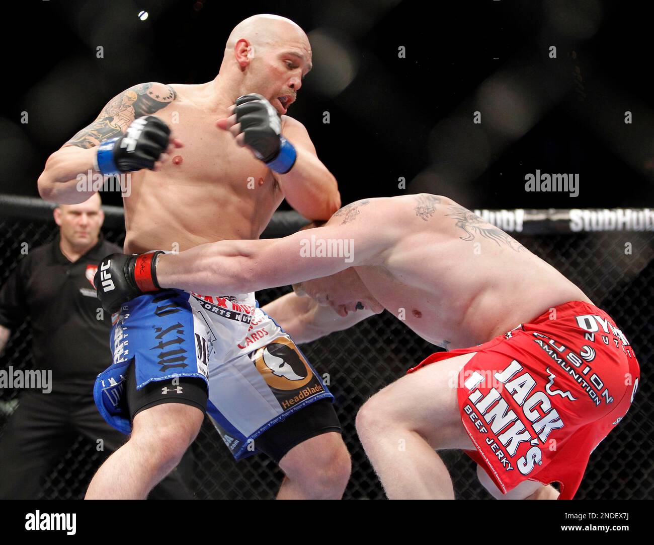 Shane Carwin, left, and Brock Lesnar compete during their UFC ...