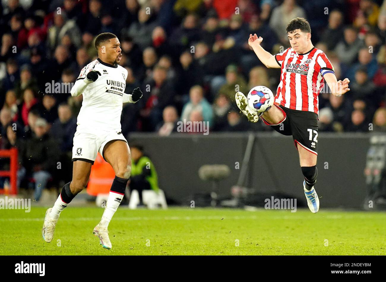Sheffield United's John Egan (right) and Middlesbrough's Chuba Akpom ...