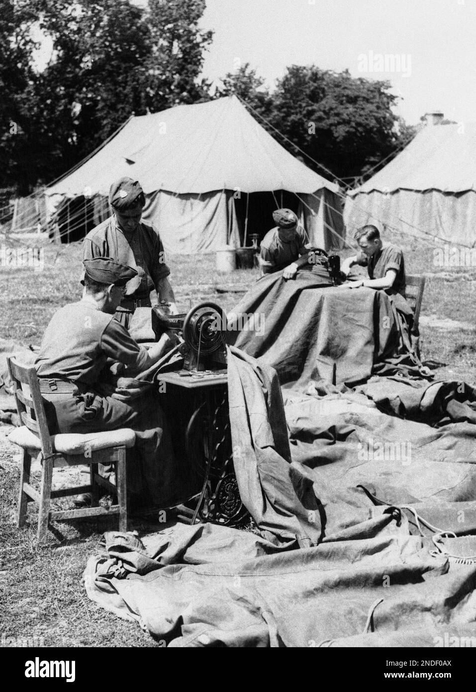 The soldiers shown at the sewing machines are mending army tents at the ...