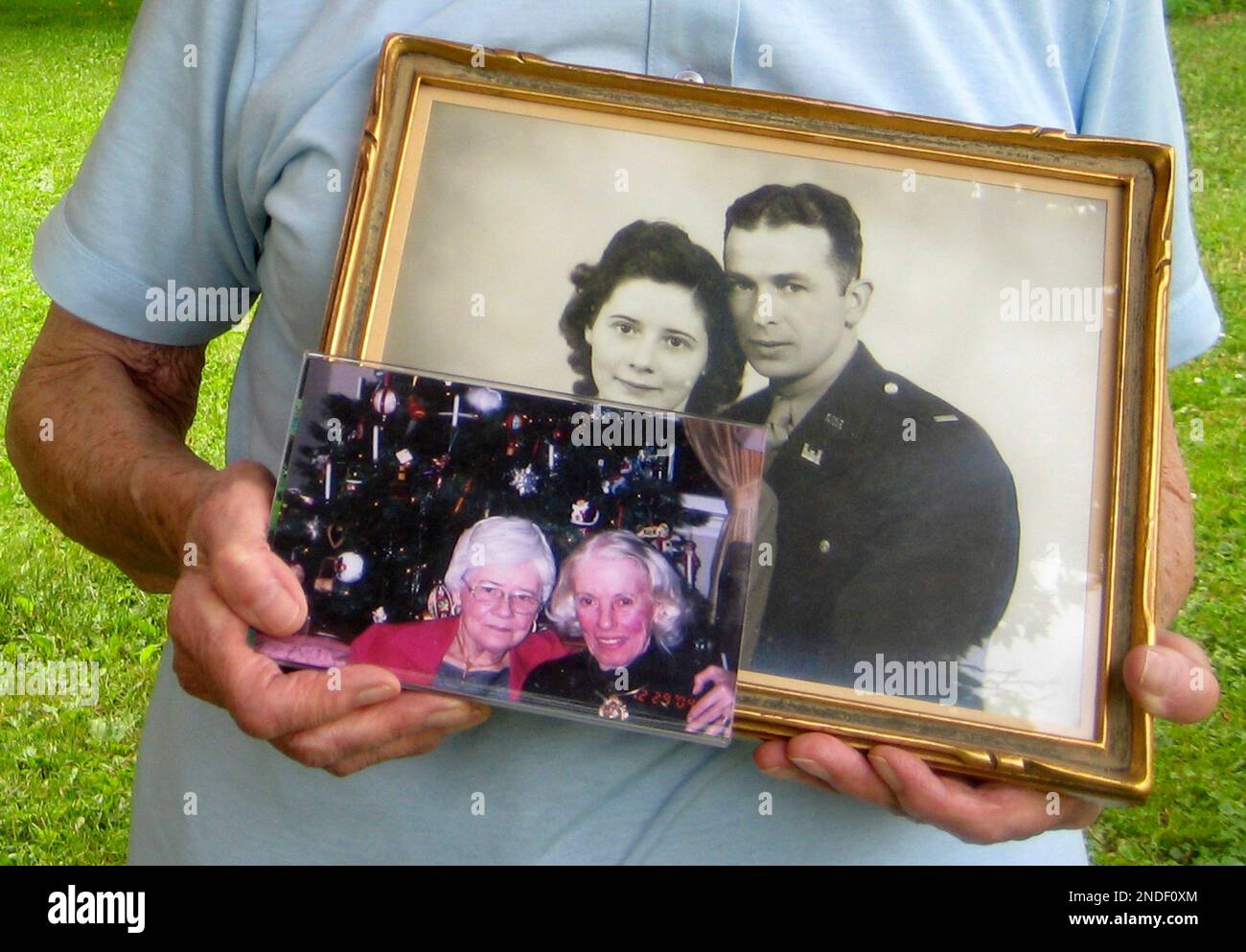 In This June 25, 2010 photo, Jean Stevens, 91, holds a photograph from ...
