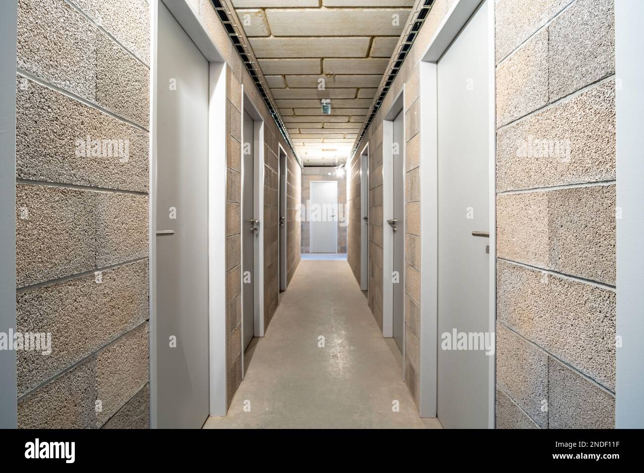 basement space in a new apartment building. corridor with a doors Stock ...