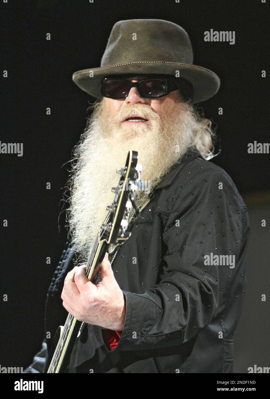 Dusty Hill of American blues rock trio, ZZ Top, performs during their ...