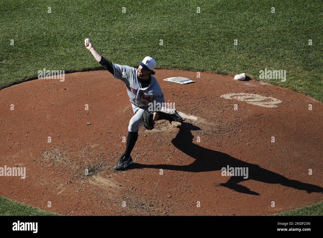 New York Mets pitcher R.A. Dickey throws a pitch during a baseball game ...