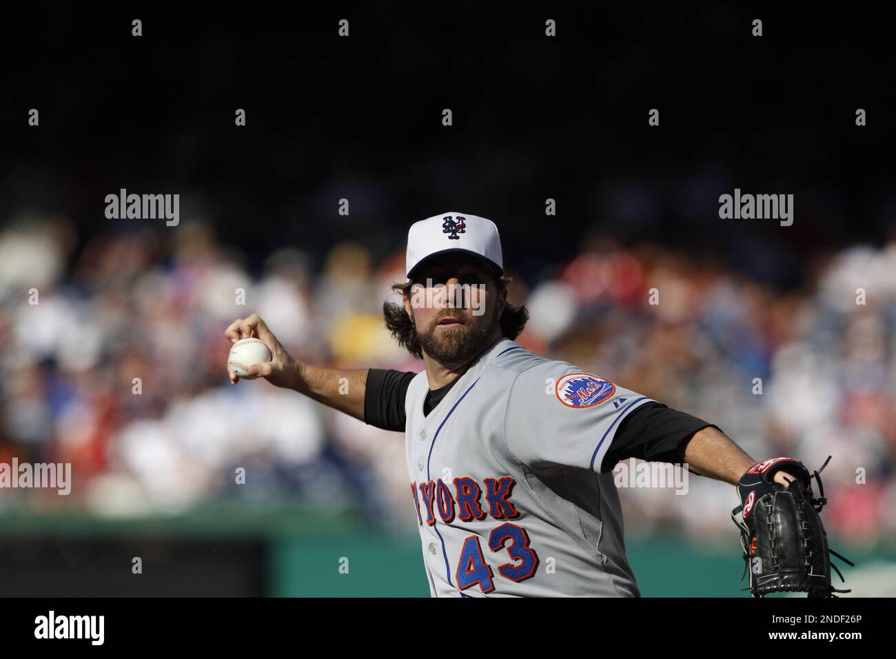New York Mets pitcher R.A. Dickey throws a pitch during a baseball game ...