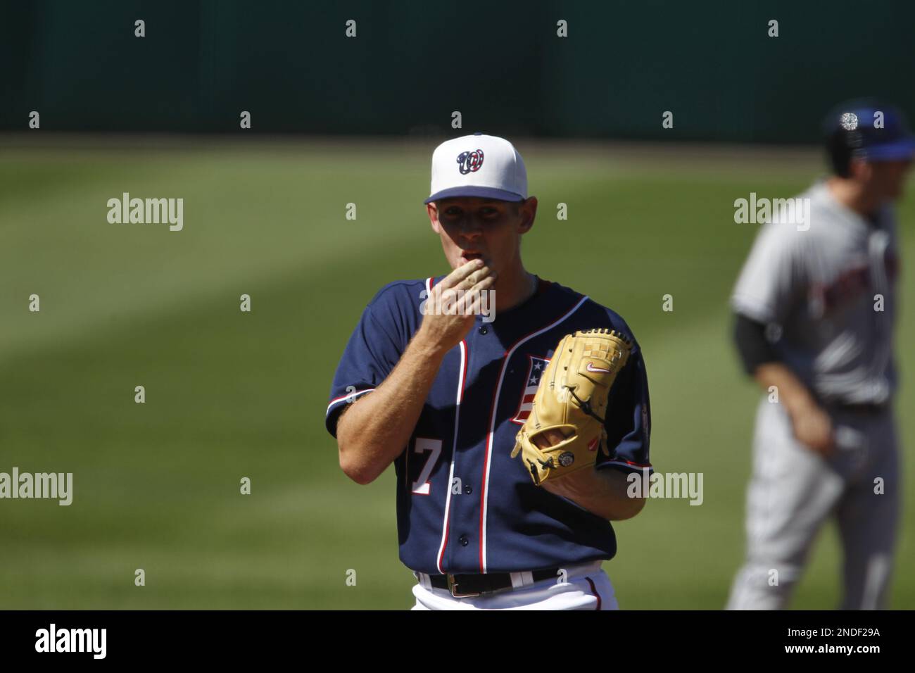 Washington Nationals pitcher Stephen Strasburg pauses during a baseball ...